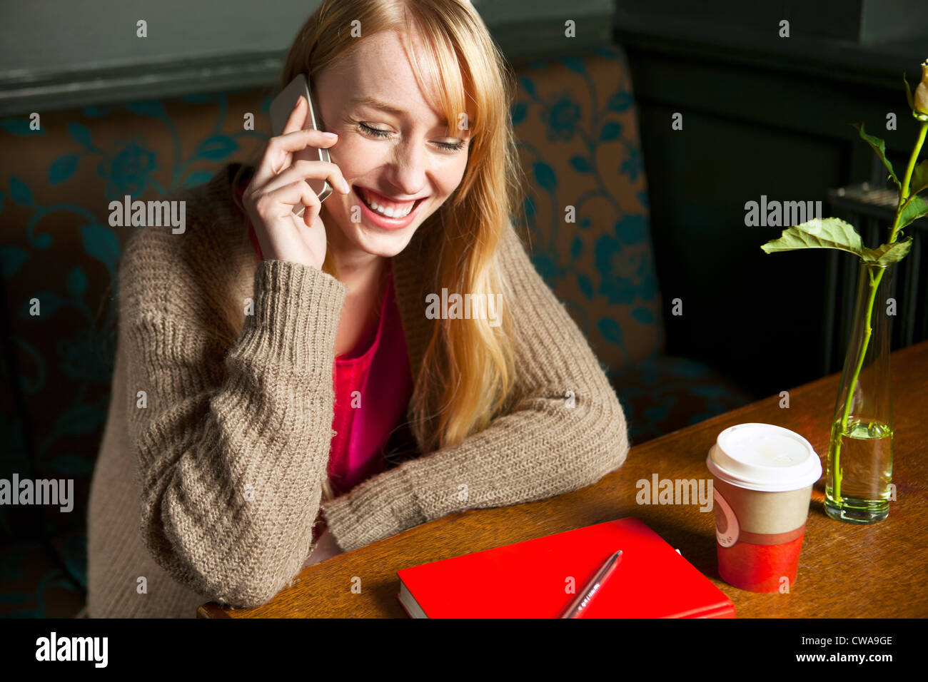 Woman on phone call laughing Stock Photo - Alamy
