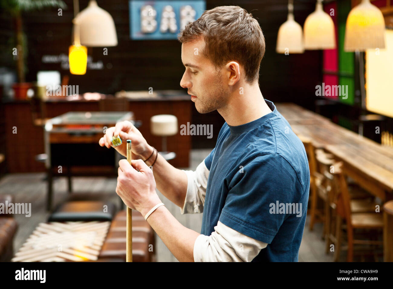 Man playing pool in bar Stock Photo - Alamy