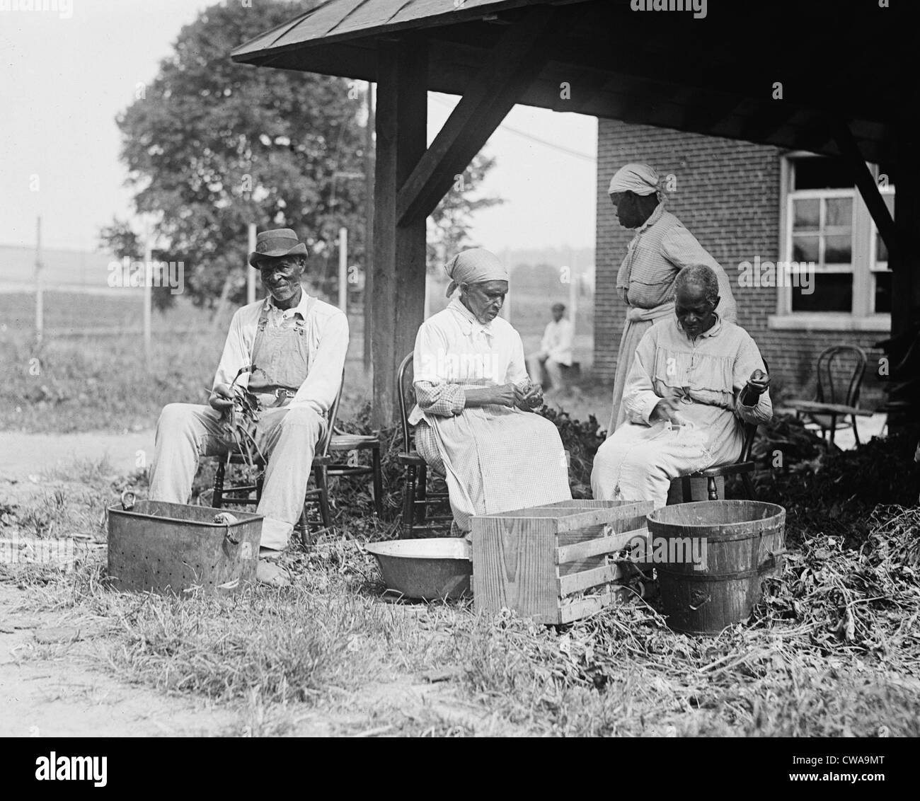 Elderly African Americans who were once slaves work together in a rural ...