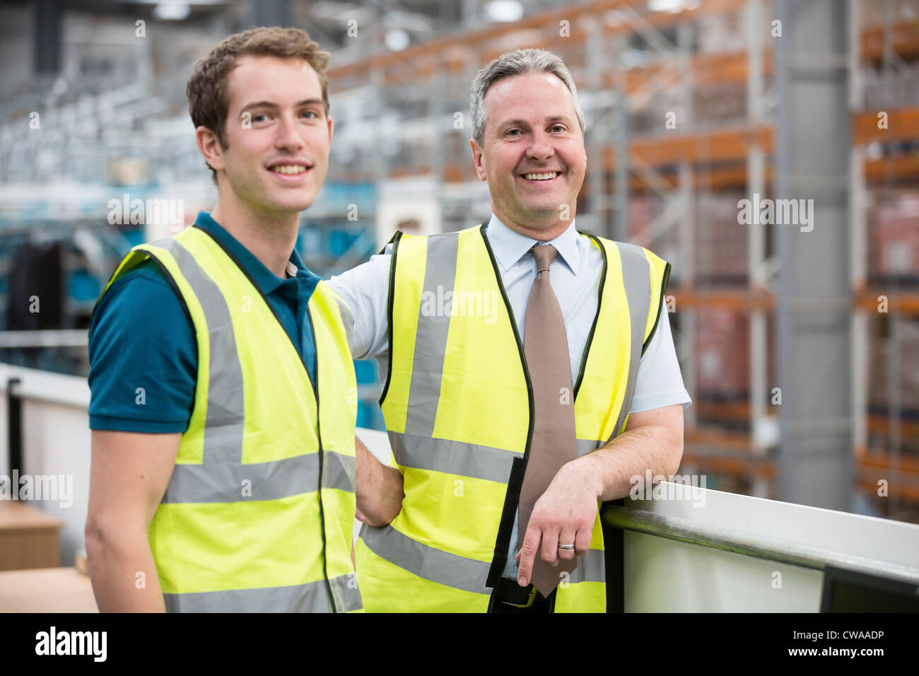 Two men in warehouse, portrait Stock Photo - Alamy