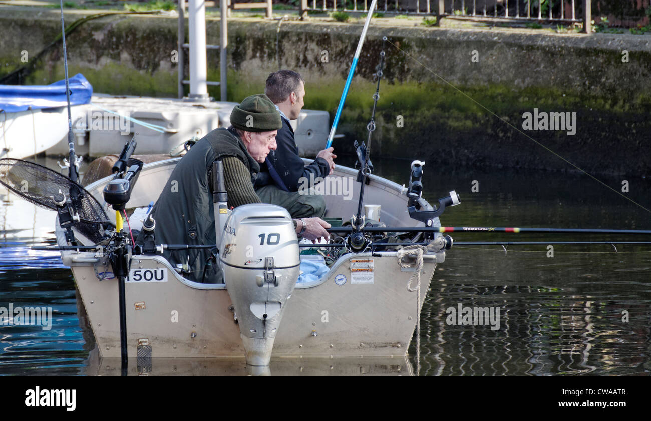 Two men fishing from a boat hi-res stock photography and images - Alamy