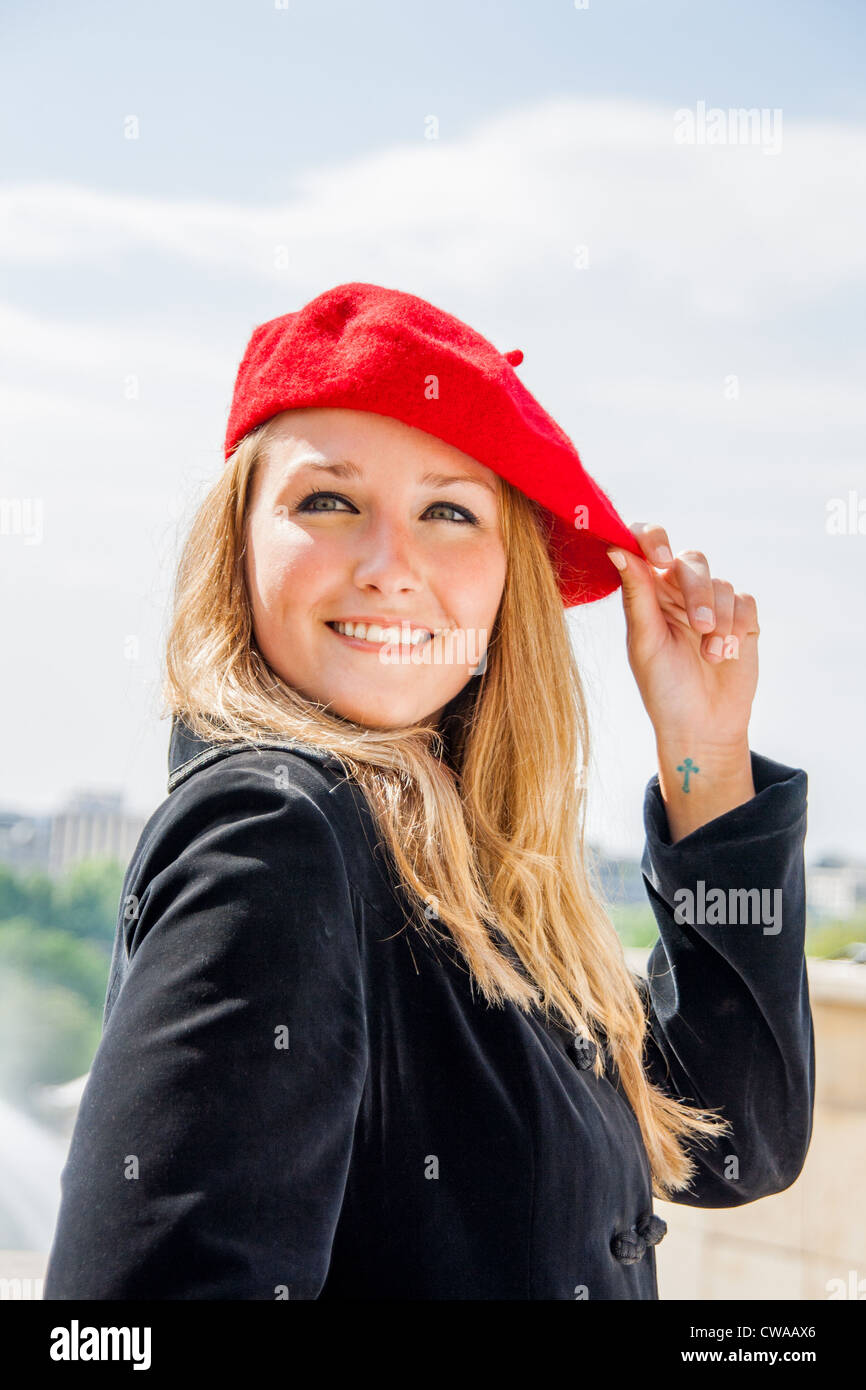 A Beautiful girl, wearing a red hat and smiling Stock Photo - Alamy