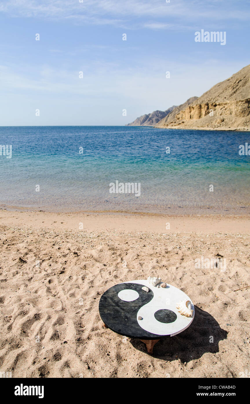 landscape wit the symbol of Yin Yang on the beach Stock Photo - Alamy