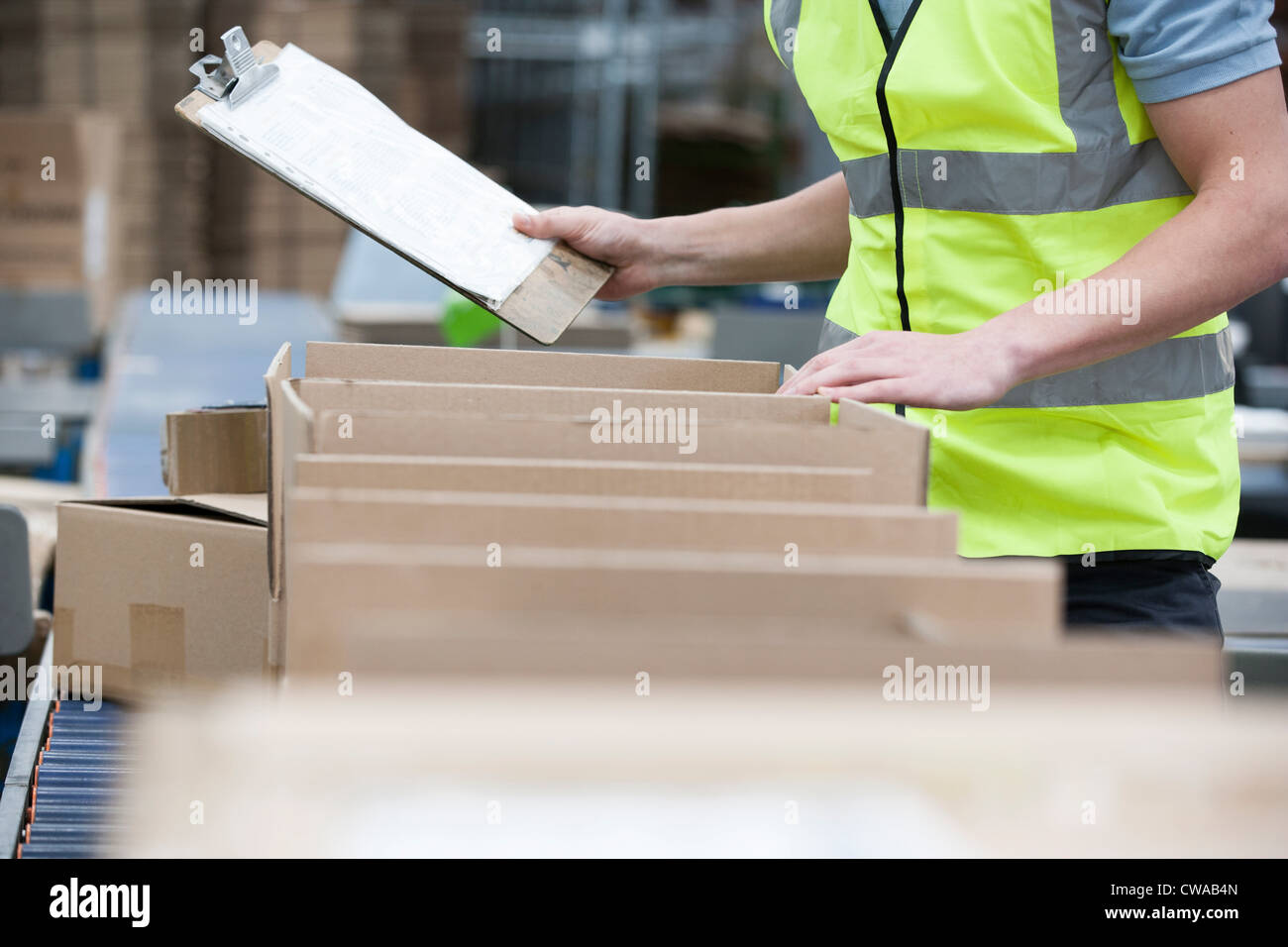Man with clipboard checking stock Stock Photo - Alamy