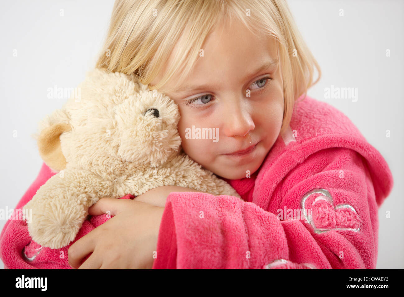 Girl hugging teddy bear Stock Photo - Alamy