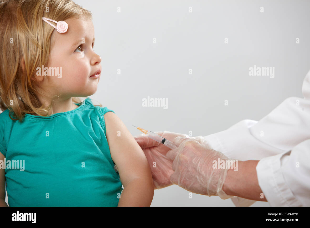 Girl having injection Stock Photo - Alamy