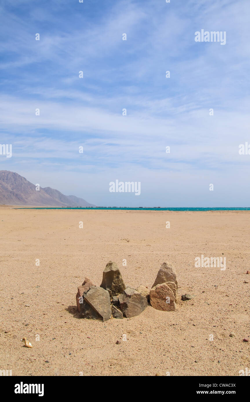 heap of rocks in the desert near the sea Stock Photo - Alamy