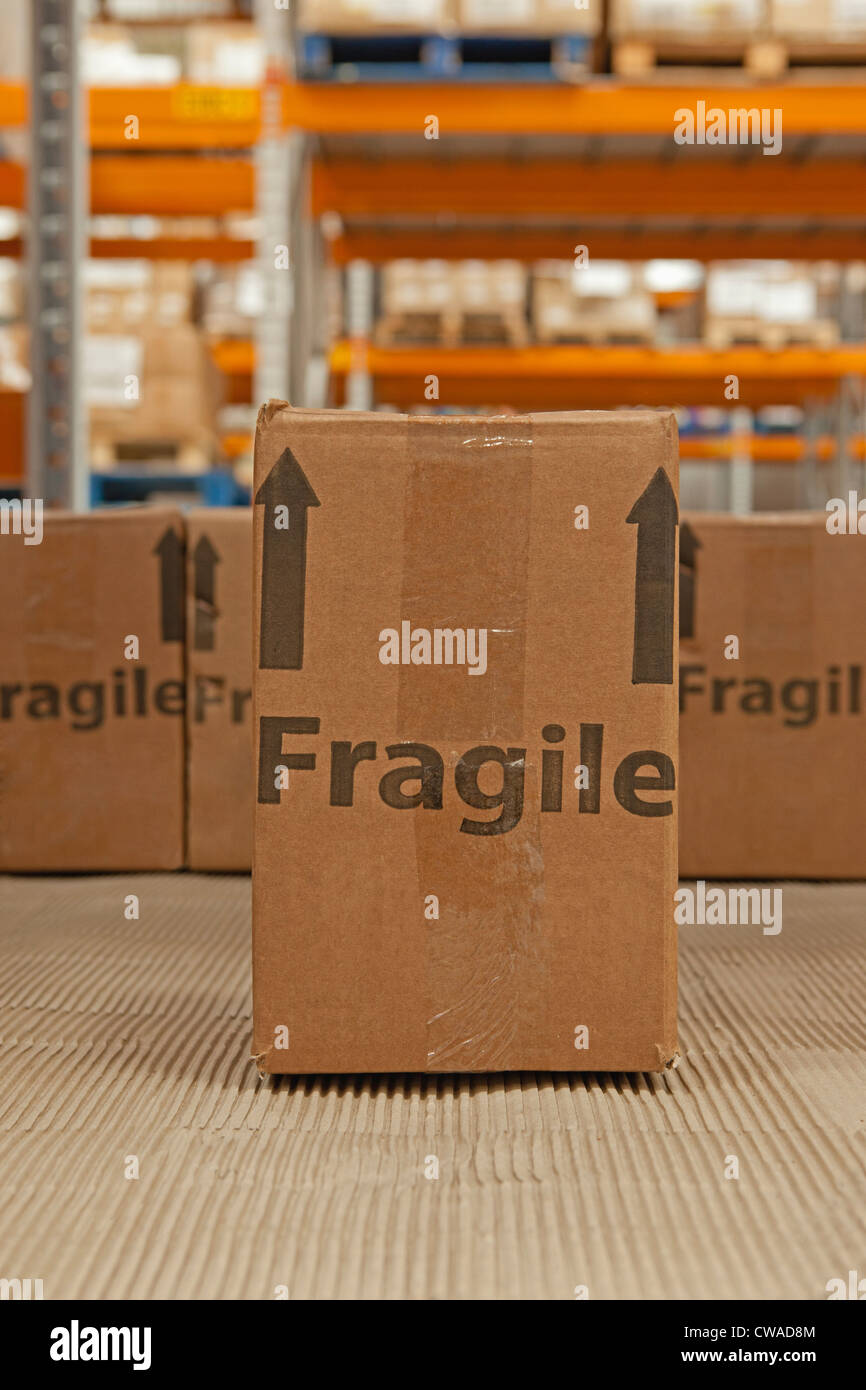Cardboard box with the word fragile printed on it Stock Photo - Alamy