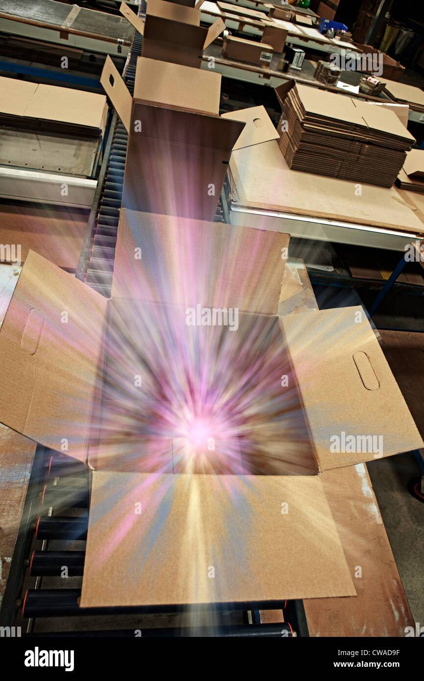 Cardboard box with sparks Stock Photo - Alamy