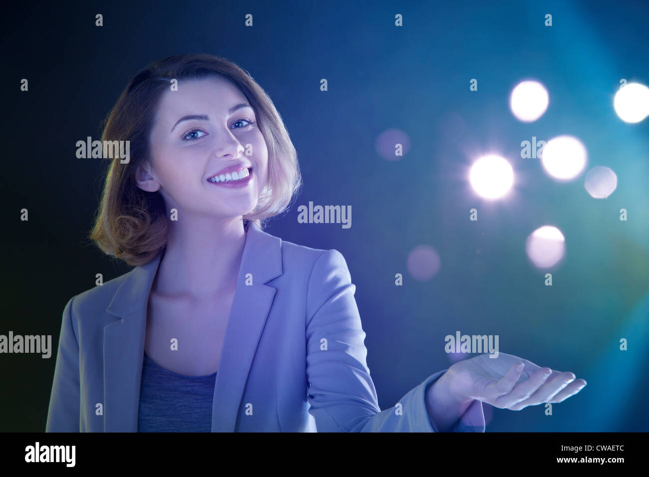 Young woman with lights Stock Photo - Alamy