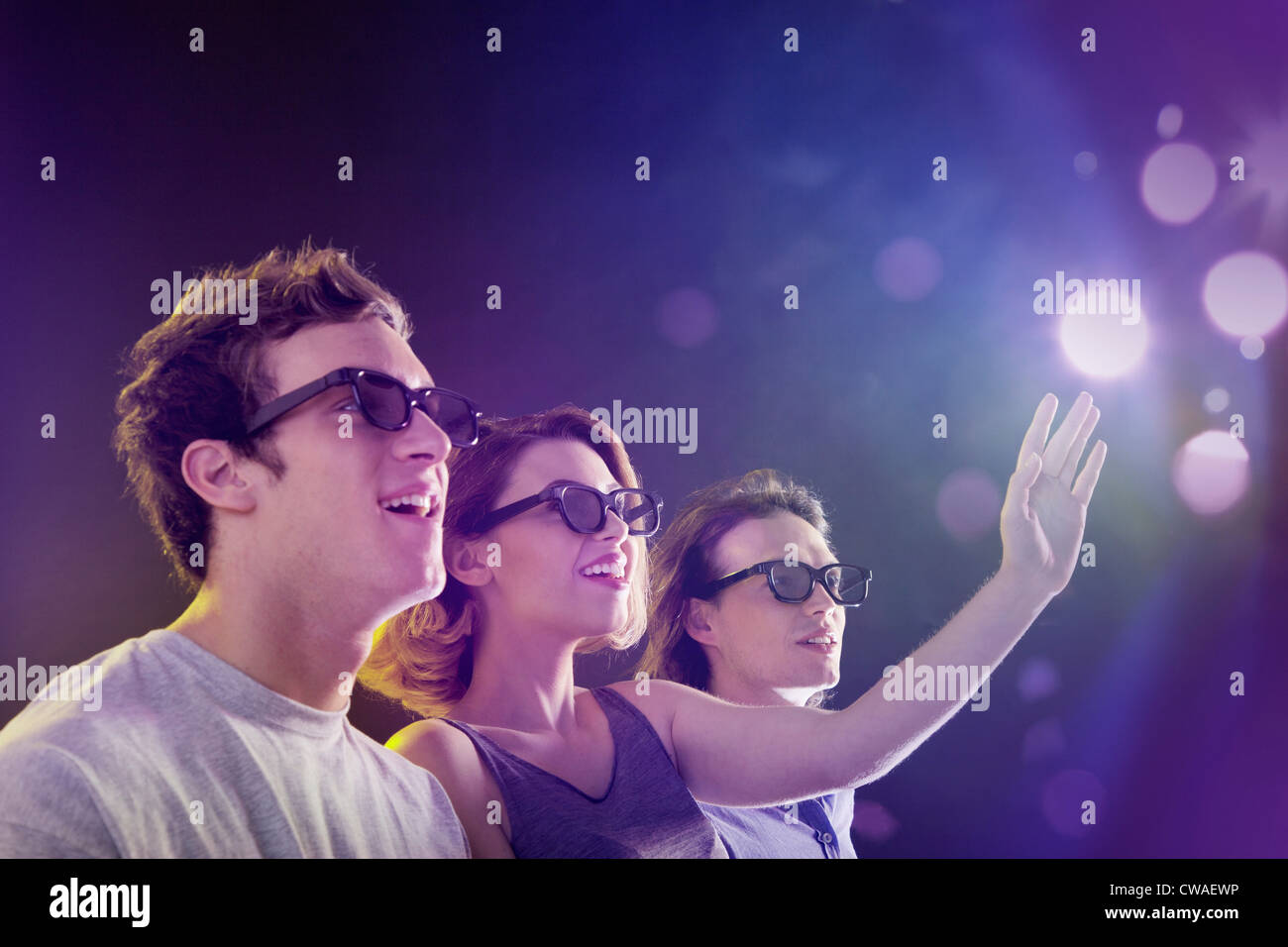 People in 3D glasses looking towards light Stock Photo - Alamy
