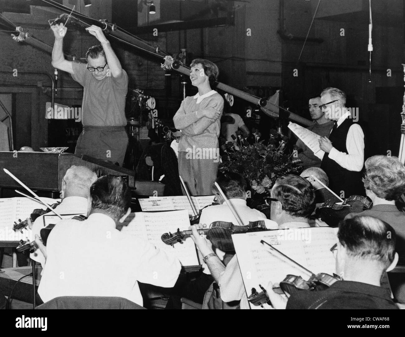 Julie Andrews singing with an orchestra in a recording studio for sound ...