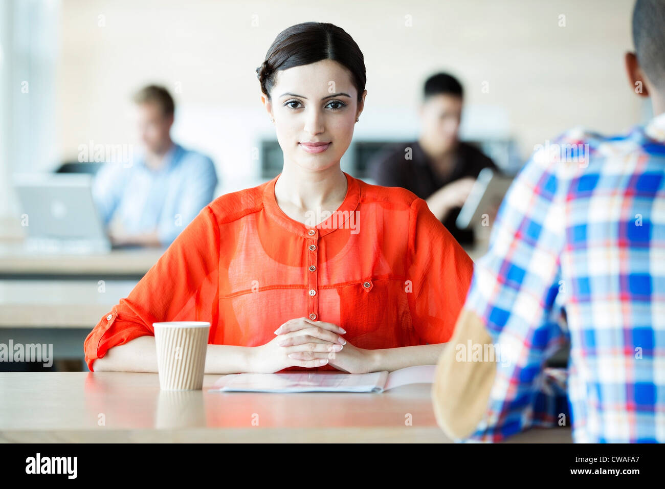 Young woman in break room Stock Photo - Alamy