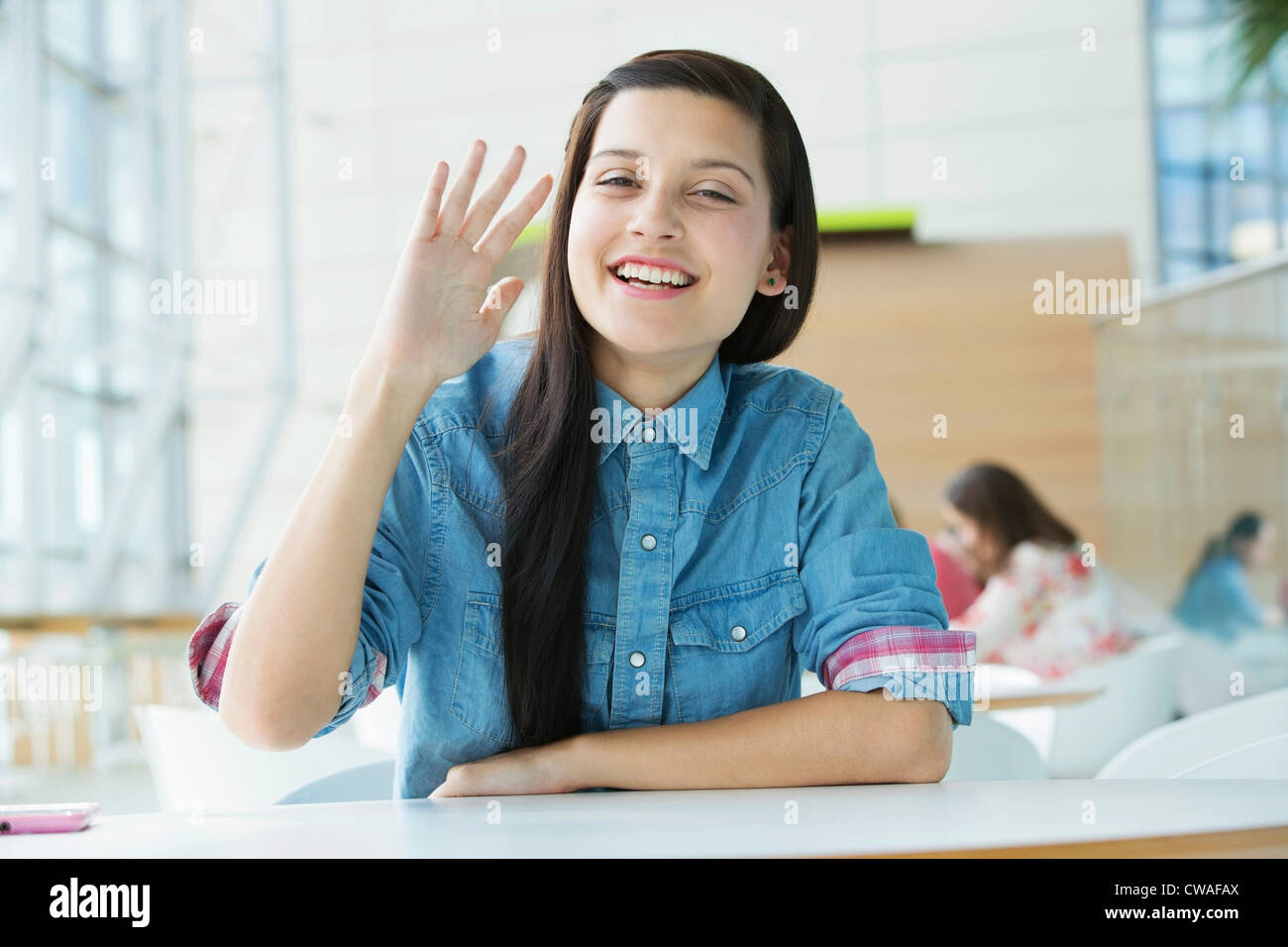 Eye contact waving hi-res stock photography and images - Alamy