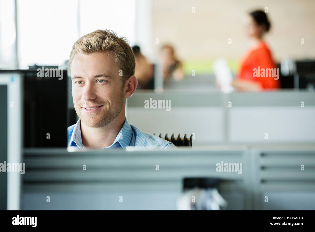 Young man working in office Stock Photo - Alamy