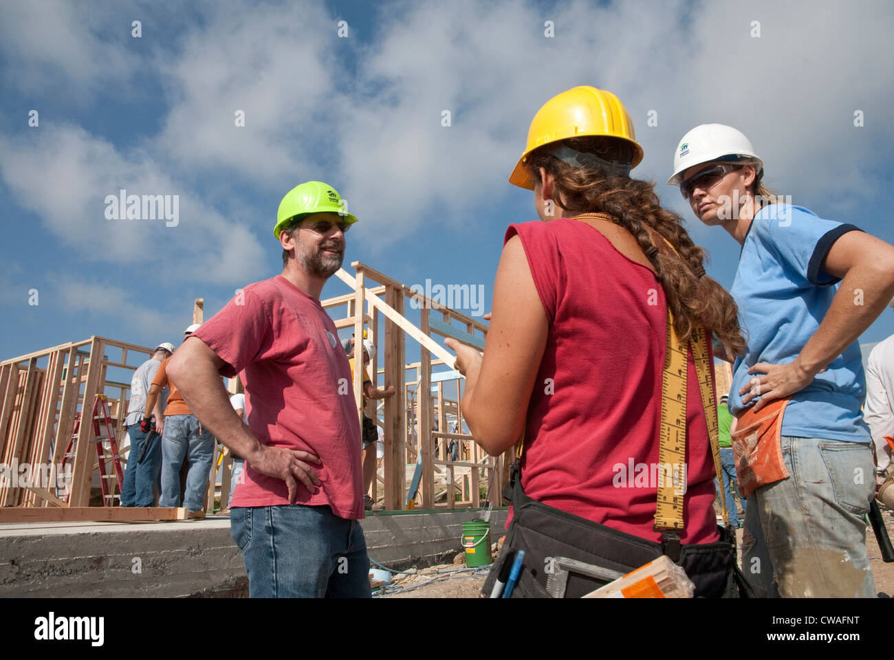 Company employees volunteer their time, help build an affordable house ...