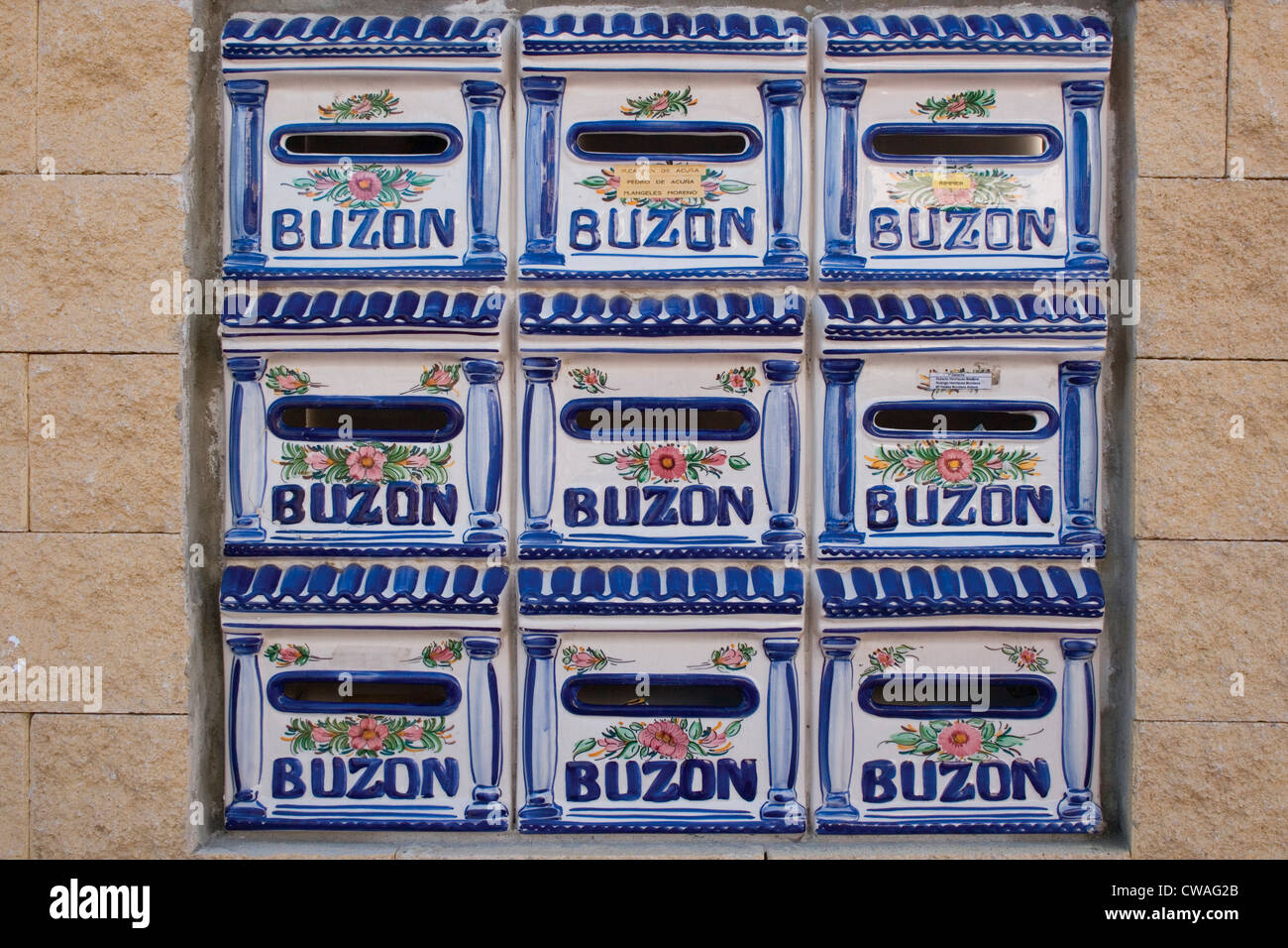 Decorated Spanish post boxes on wall Stock Photo - Alamy