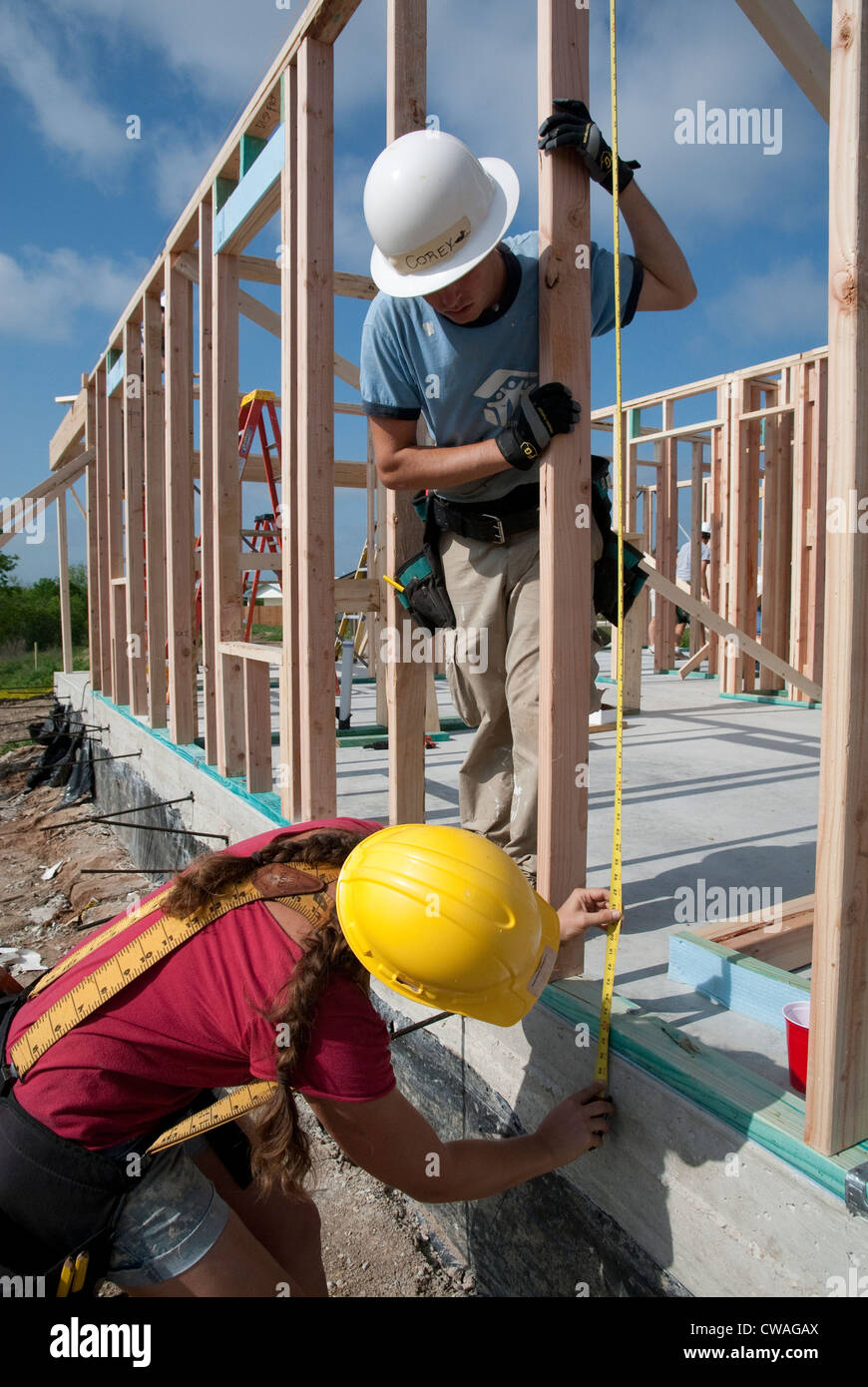 Company employees volunteer their time, help build an affordable house ...