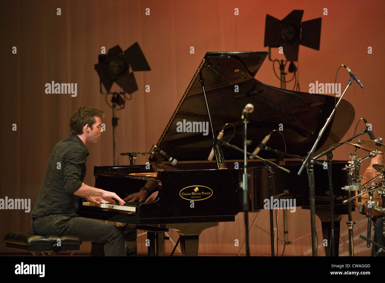 Jazz pianist Gwilym Simcock playing with the LIGHTHOUSE trio performing ...