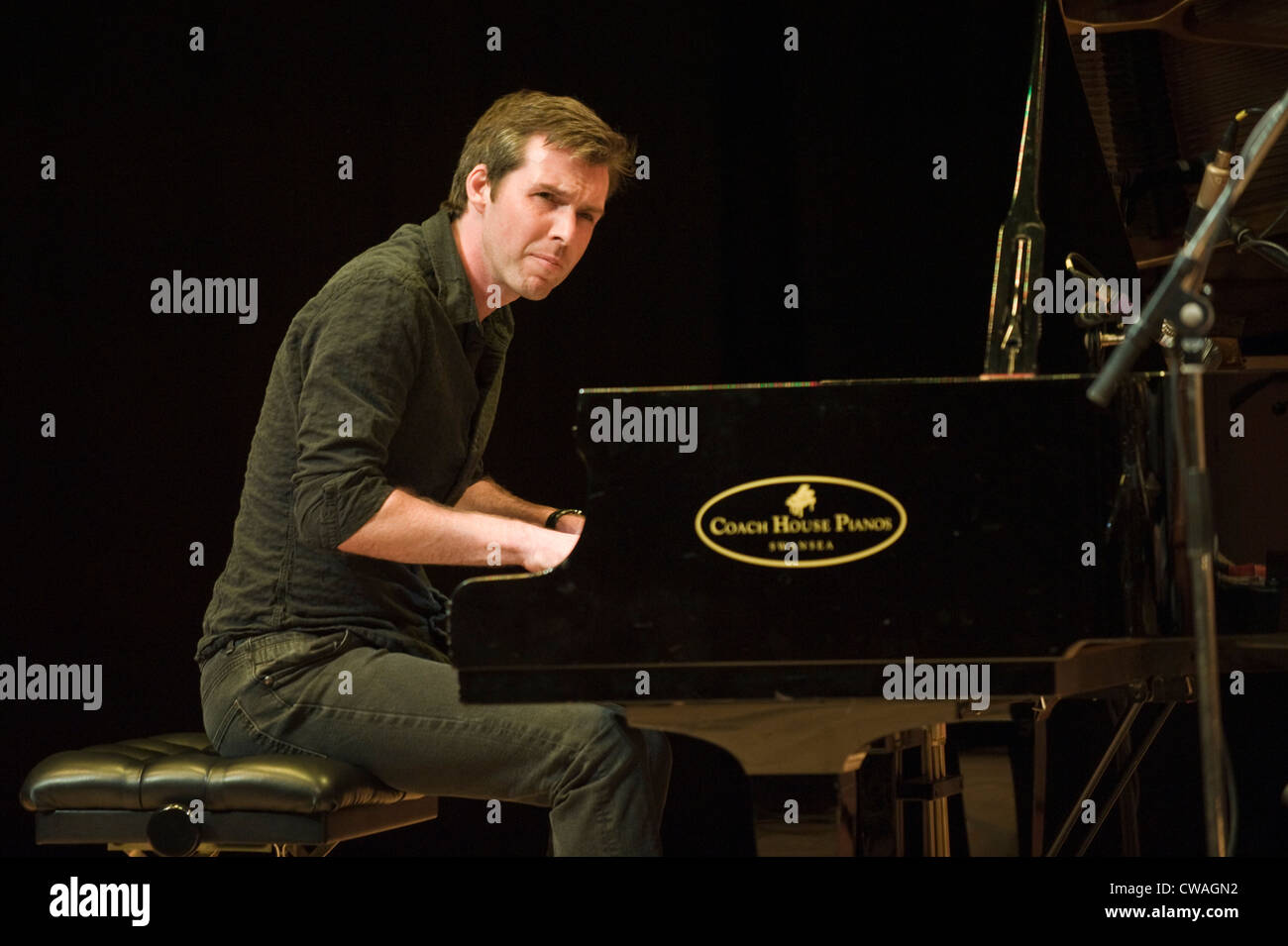 Jazz pianist Gwilym Simcock playing with the LIGHTHOUSE trio performing ...