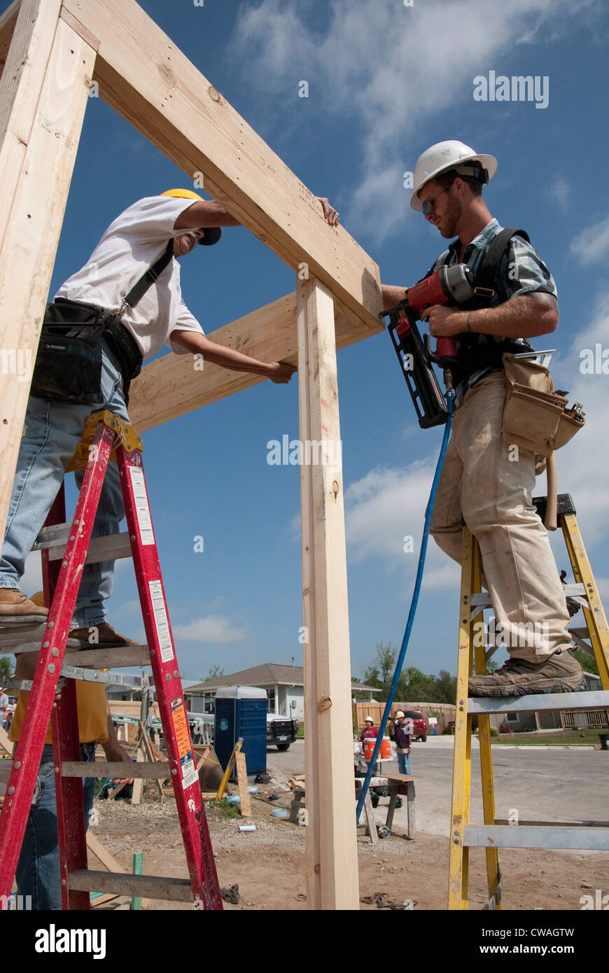 Company employees volunteer their time, help build an affordable house ...