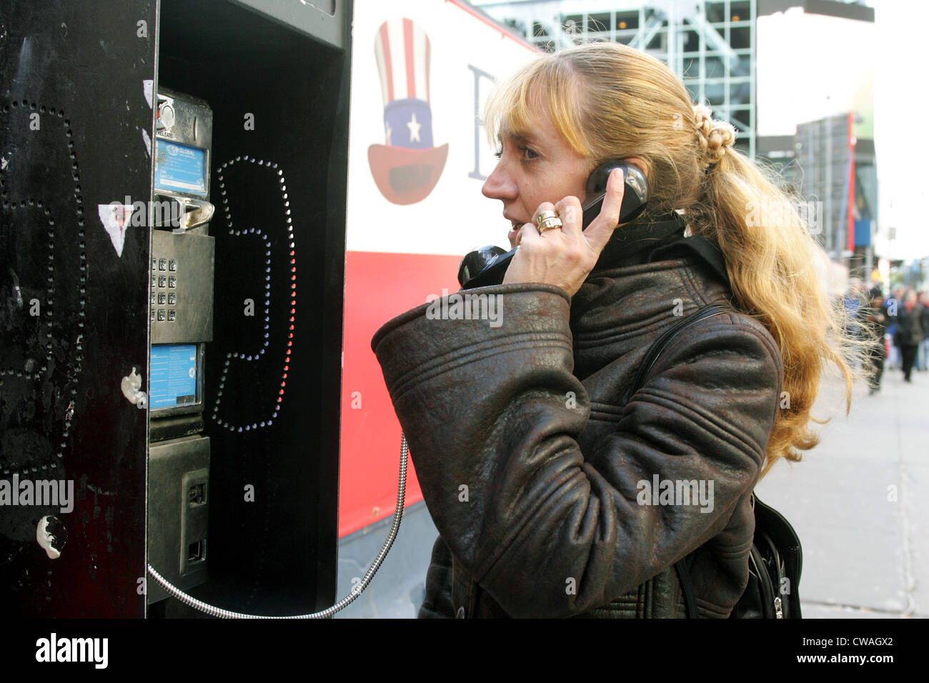 New York, a woman telephoned to a public telephone Stock Photo - Alamy