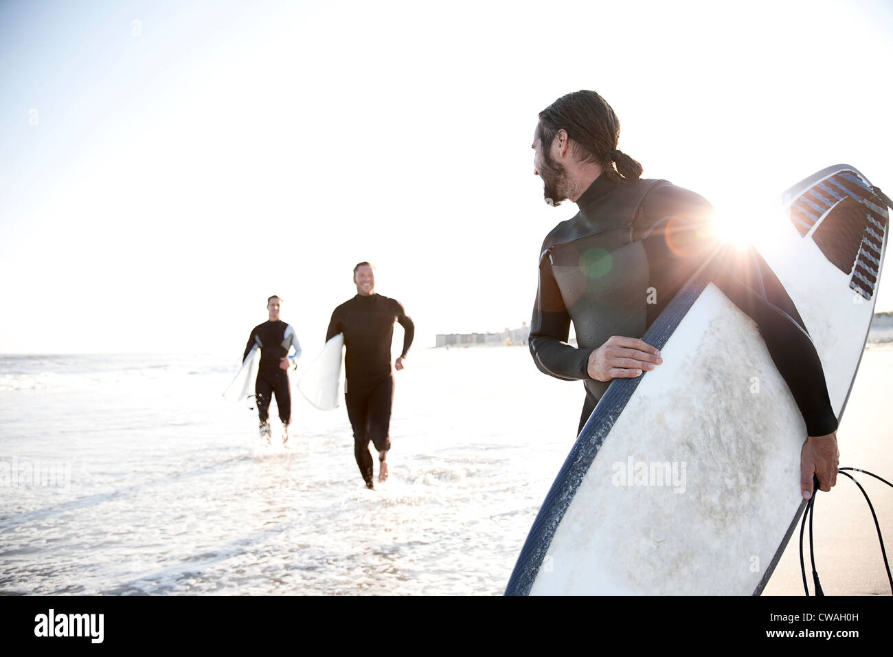 Three surfers hi-res stock photography and images - Alamy