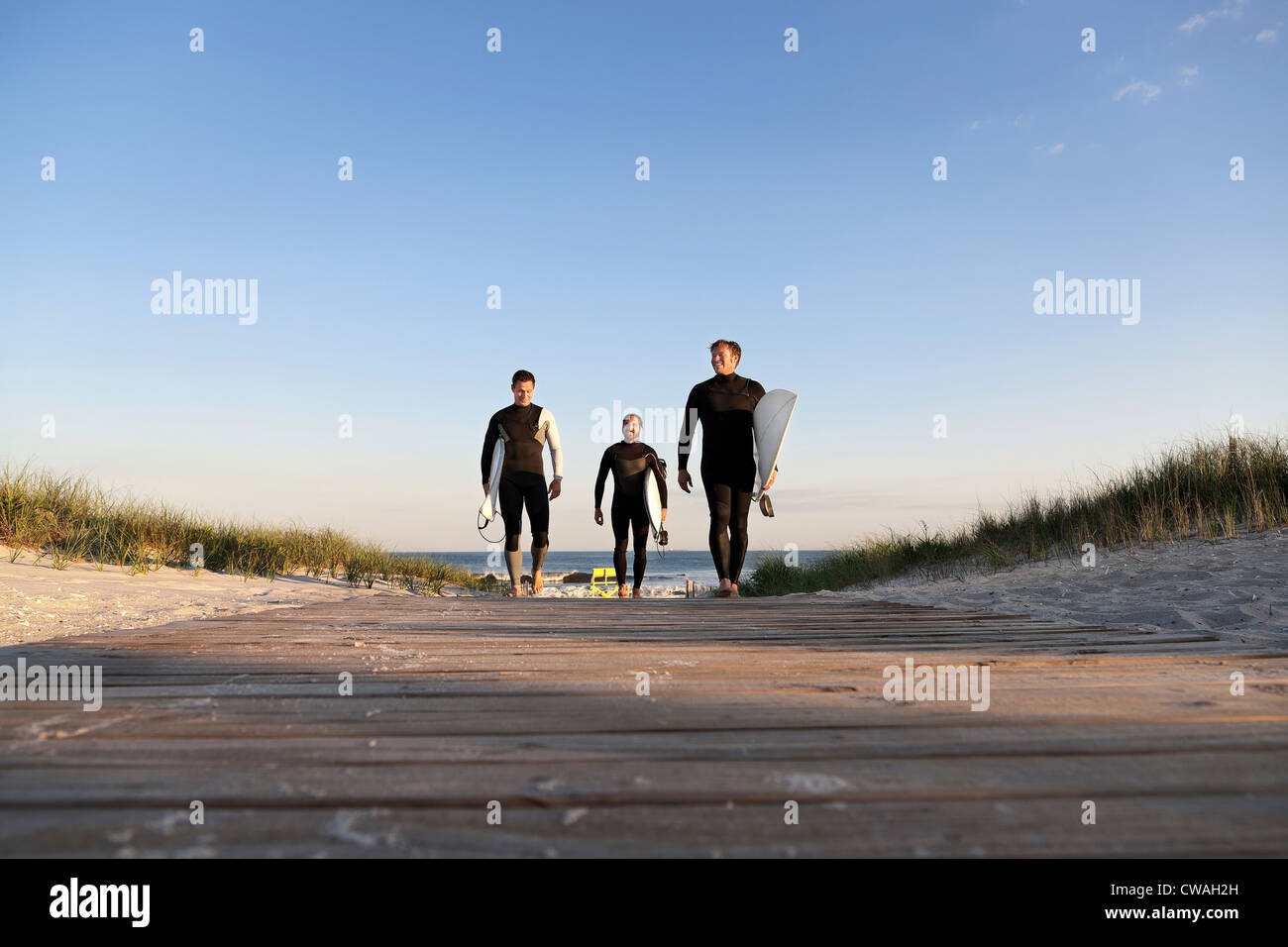Three surfers hi-res stock photography and images - Alamy