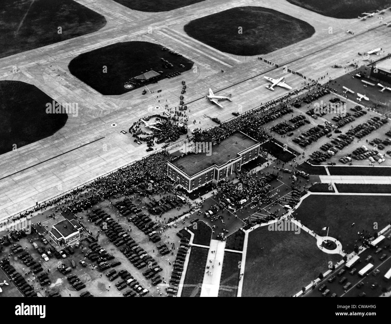 Howard Hughes lands at Floyd Bennett Airport in his silver monoplane ...