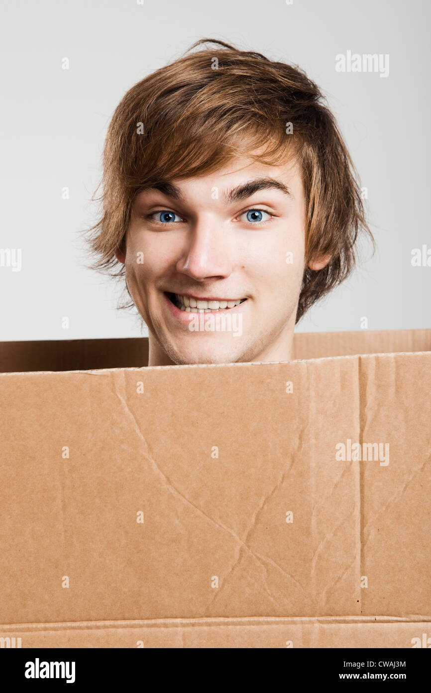 Man hiding inside cardboard box hi-res stock photography and images - Alamy