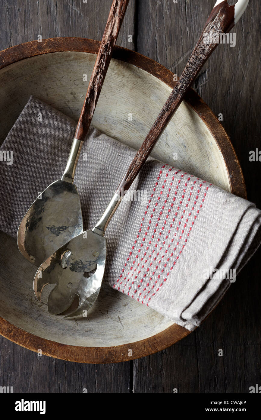 Empty salad bowl with serving spoons Stock Photo - Alamy
