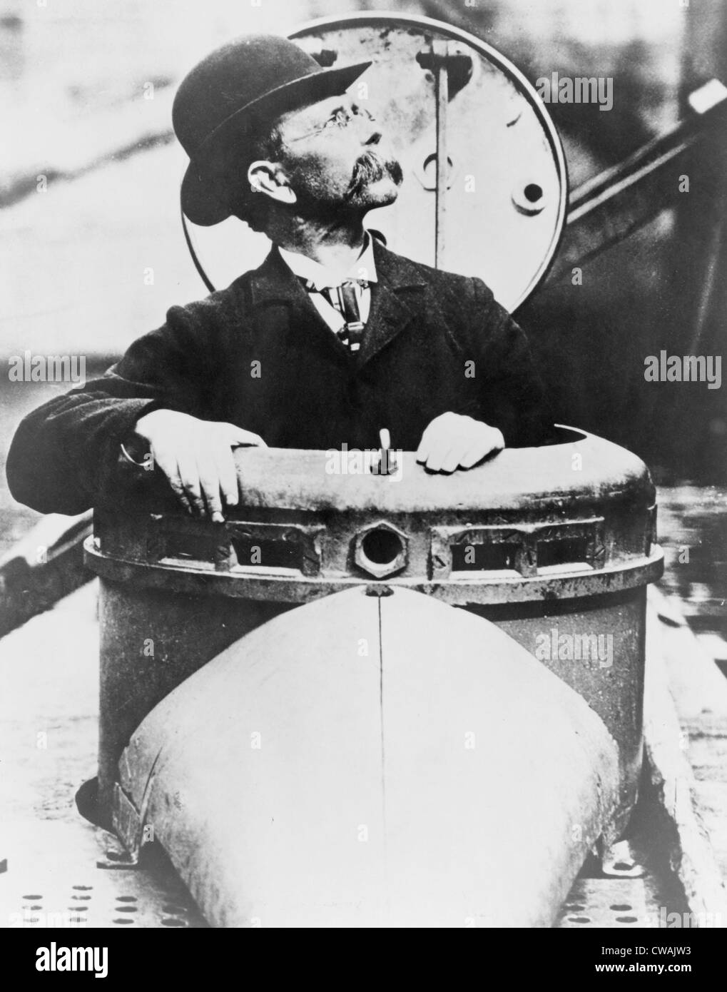 John P. Holland (1984-1914), climbing up hatch of his invention, the ...