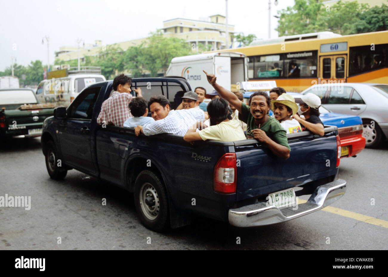 Pickup loaded with men Stock Photo - Alamy