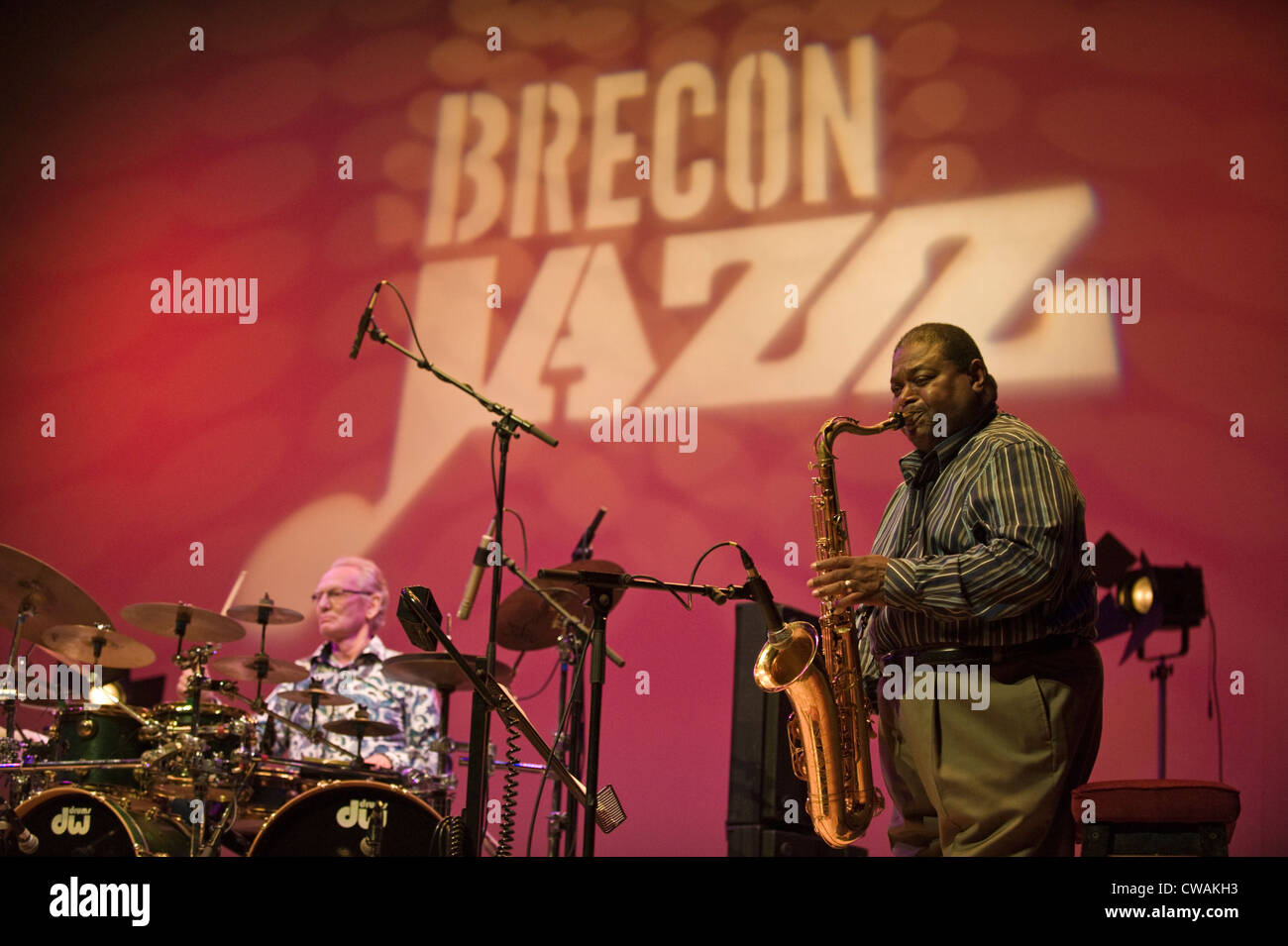 Tenor sax player Pee Wee Ellis performing with drummer Ginger Baker at ...