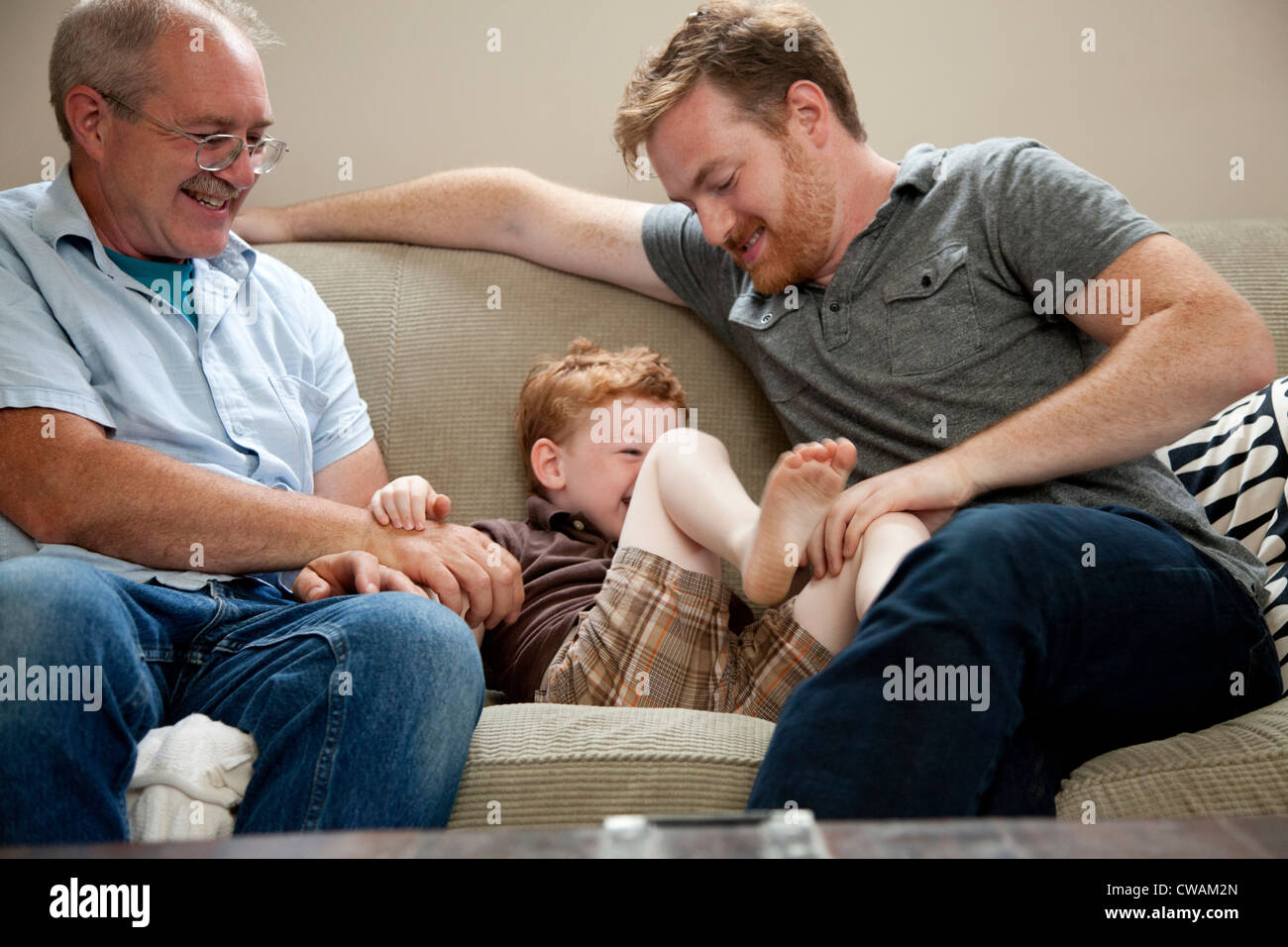 Son being tickled hi-res stock photography and images - Alamy