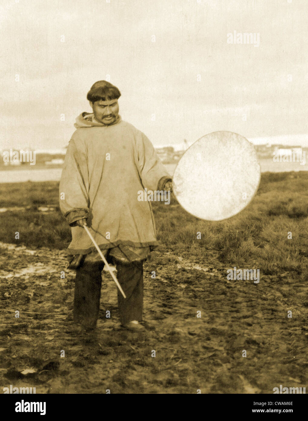 Drummer for Eskimo dance in Nome Alaska. The traditional Inuit drum was ...