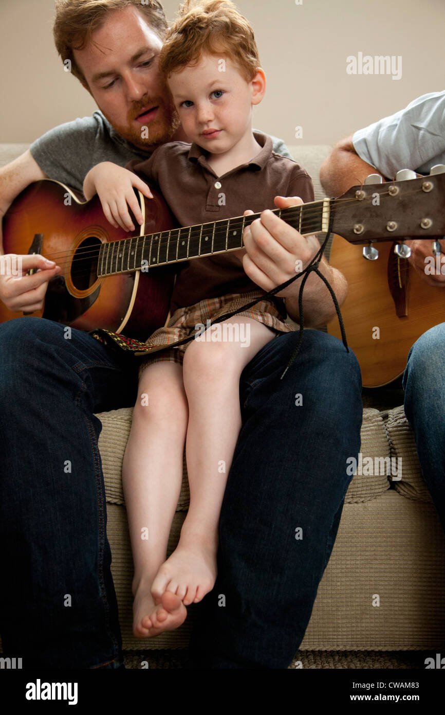 Father Teaching Son Play Guitar High Resolution Stock Photography and ...