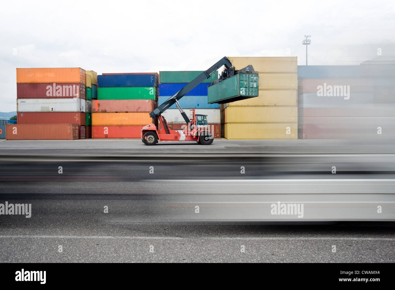 Truck lifting shipping containers Stock Photo - Alamy