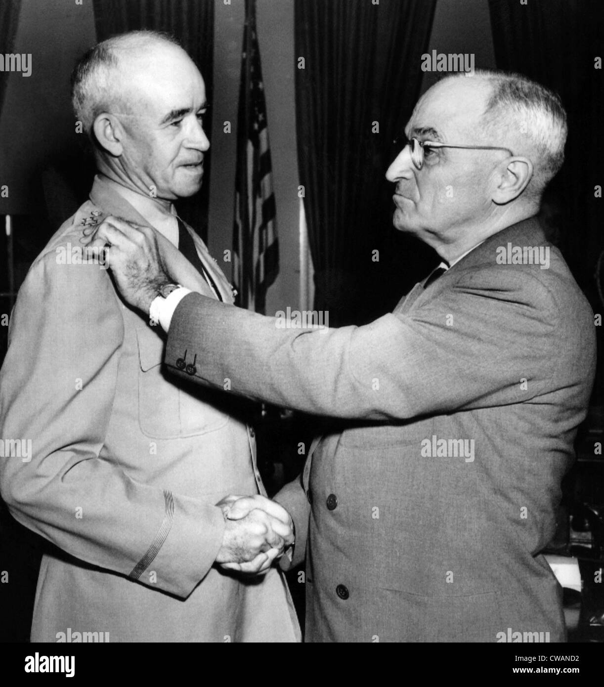 President Harry Truman pins the silver insignia of General of the Army ...