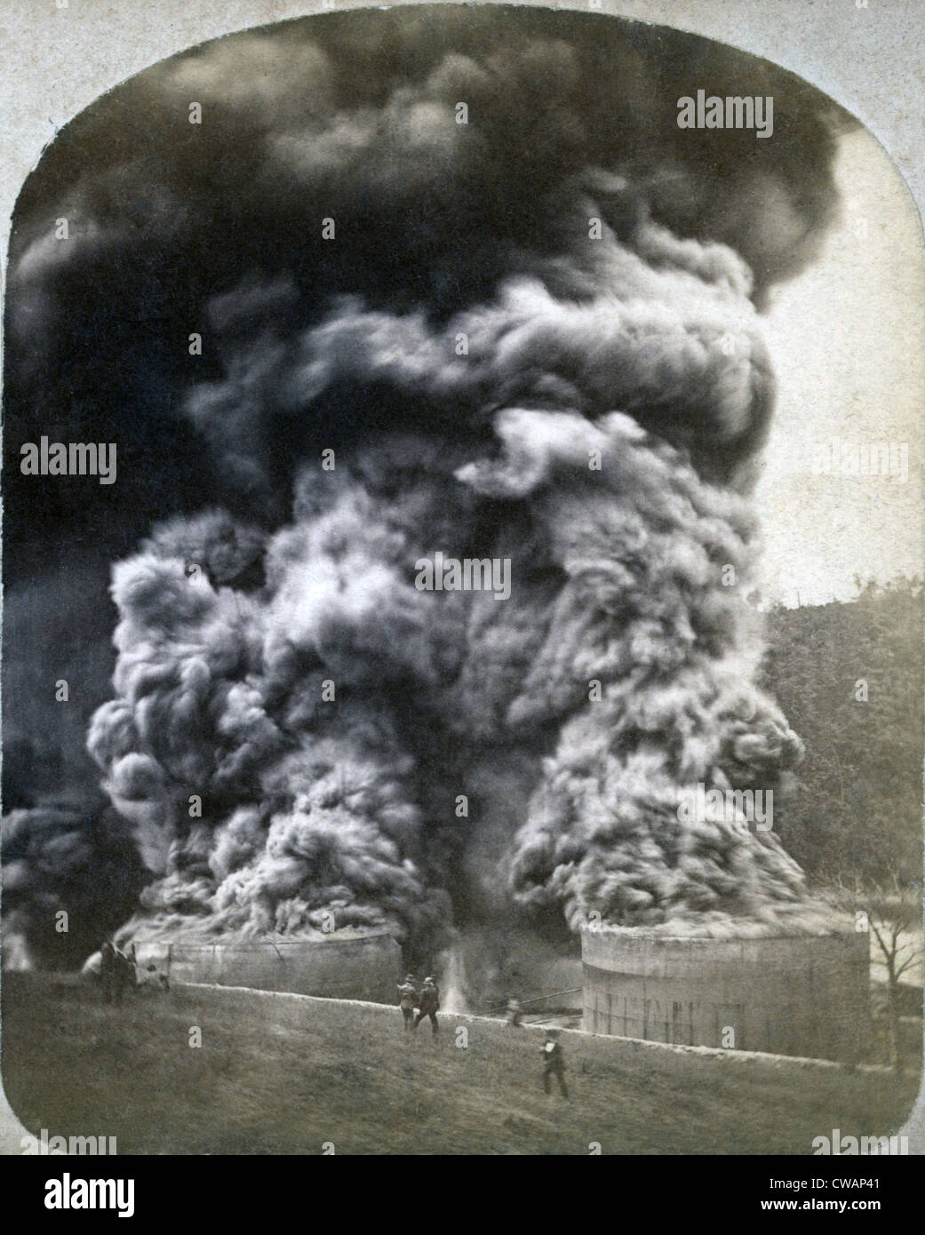 The Pennsylvania oil region. Black smoke spewing from the tops of two ...