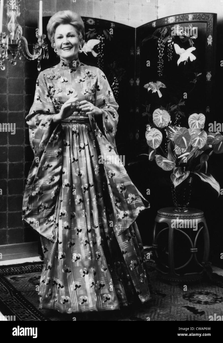 First Lady Pat Nixon modeling an evening gown for the cover of Ladies ...