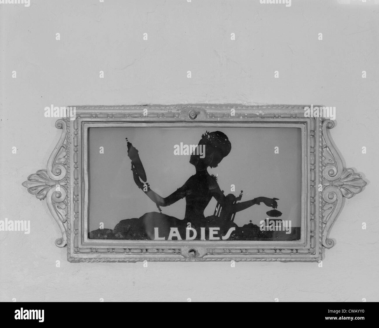 Movie Theaters, restroom door, detail depicting a woman with a mirror ...