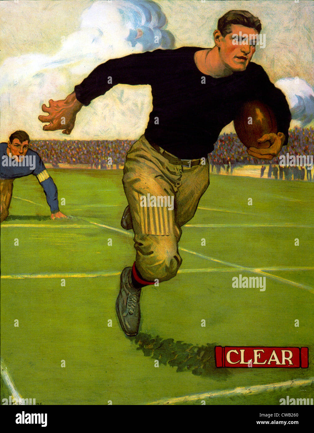 Football. A college football player slips clear of a tackle and runs ...