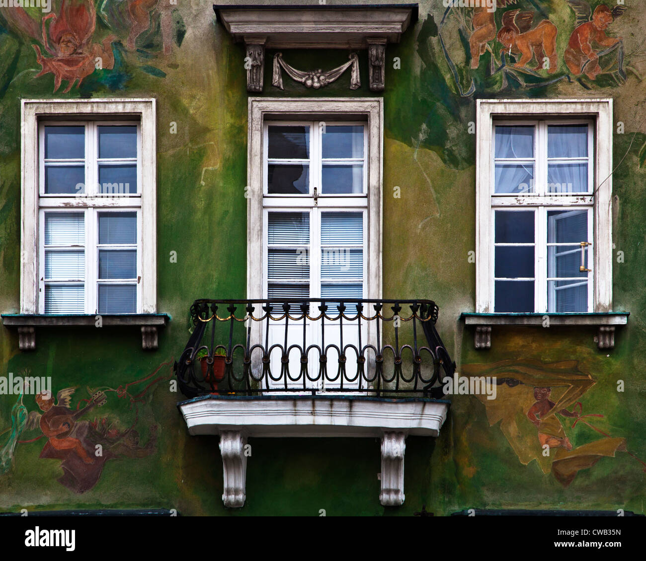 A house with a decorated painted facade and balcony in old town market ...