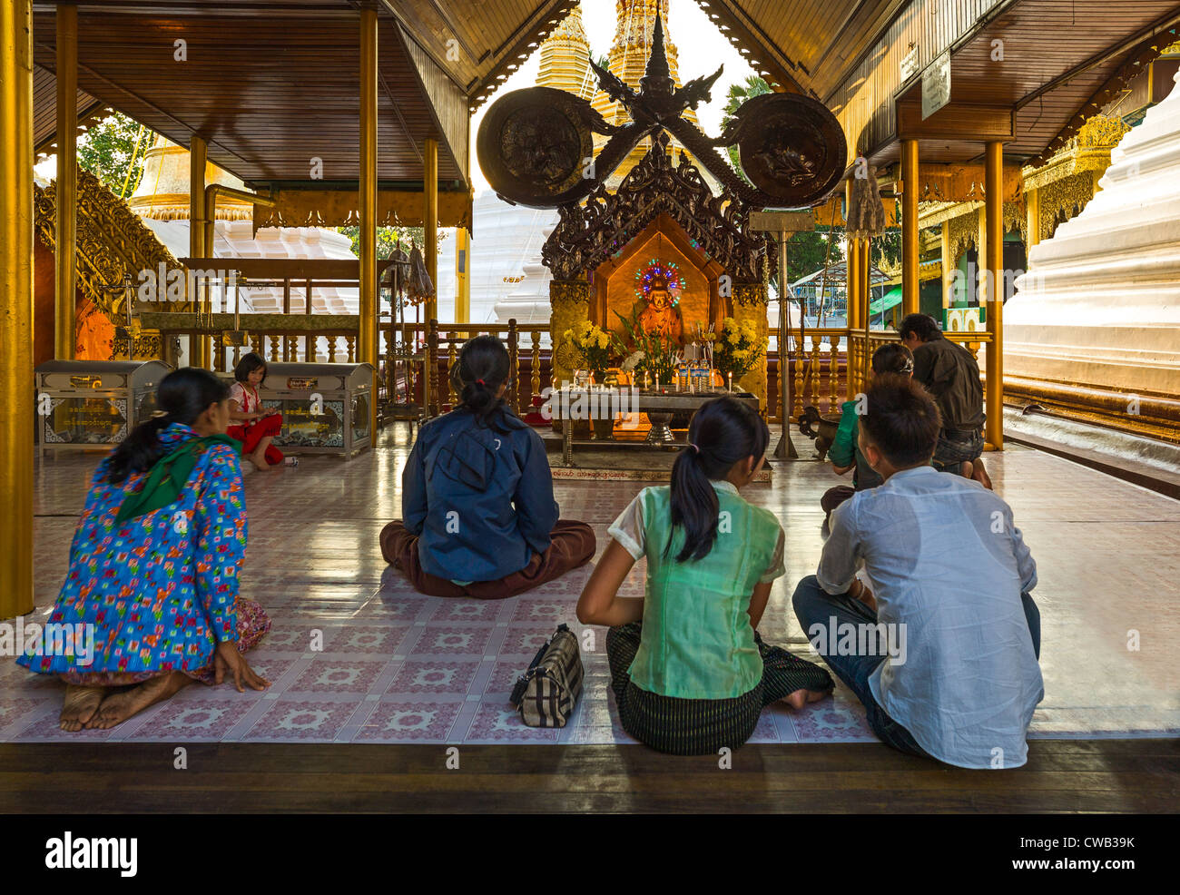 Myanmar, Yangon, religious in prayer in the Swedagon Pagoda Stock Photo ...
