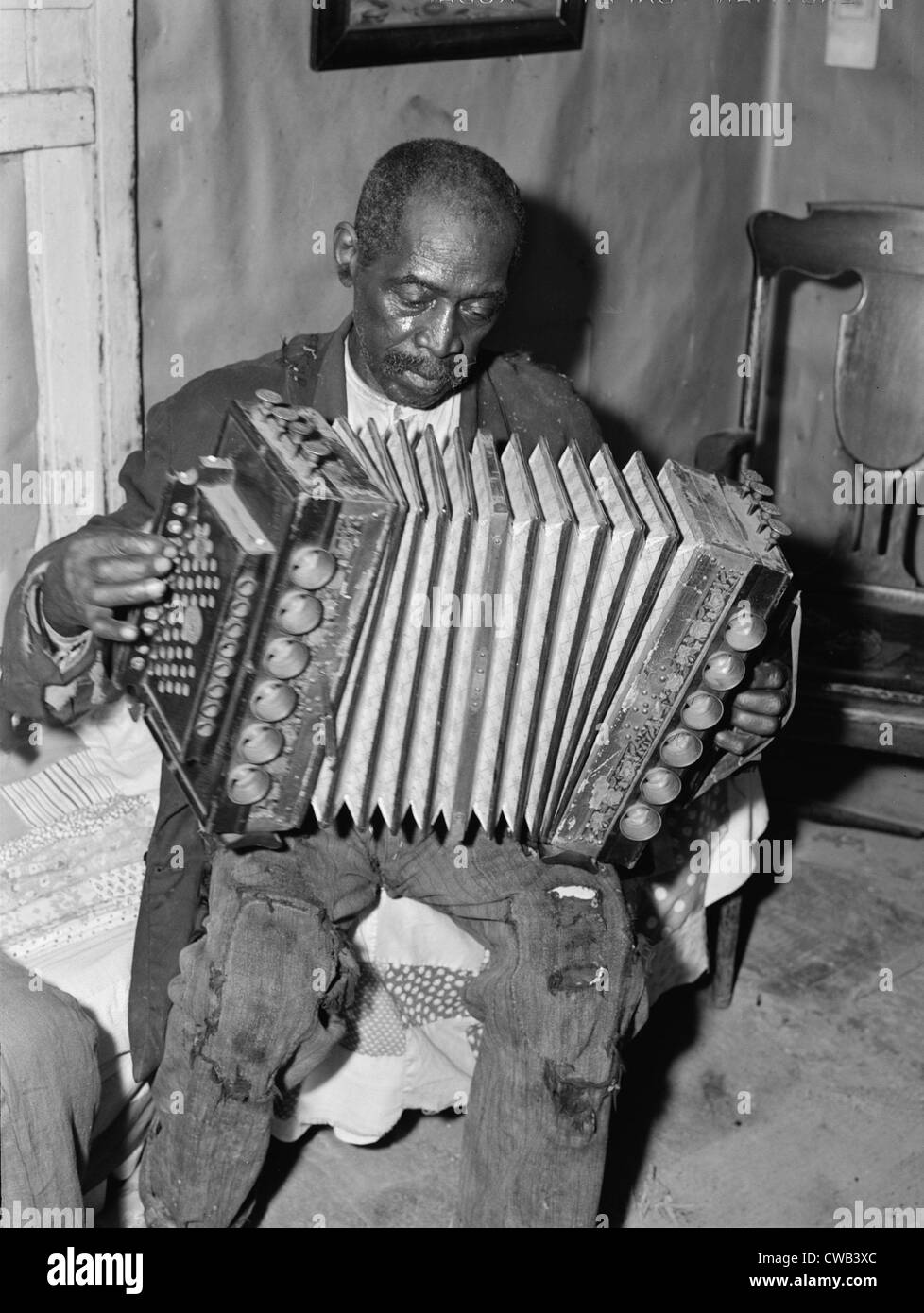 Portrait of an African American man playing an accordion, original ...