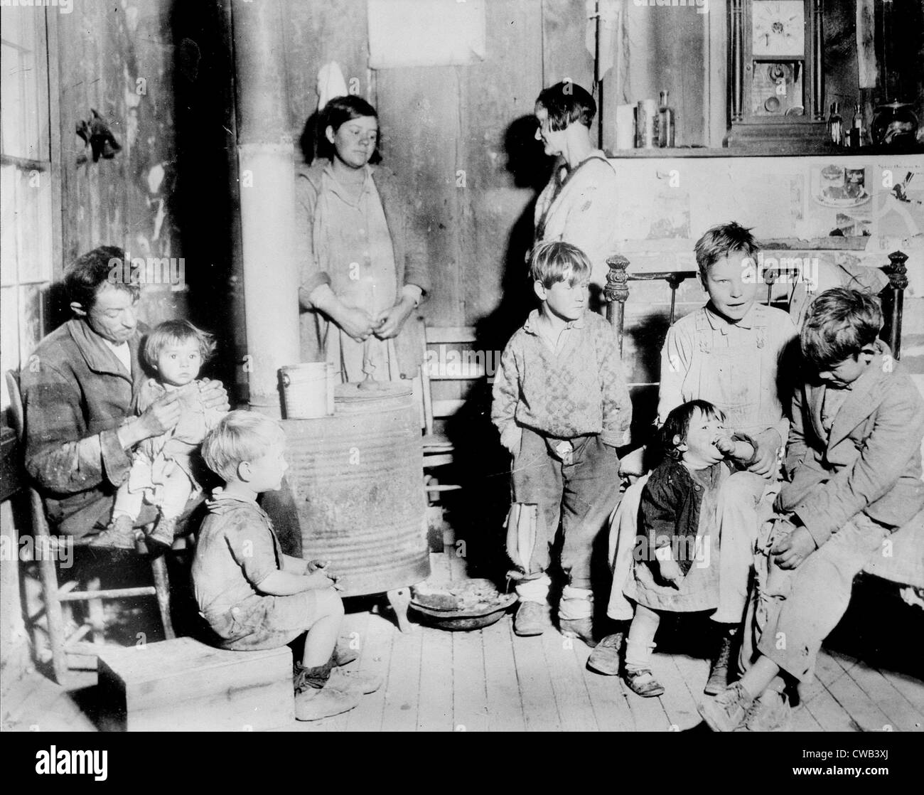 A poor family, interior showing family of nine, photograph by Lewis ...