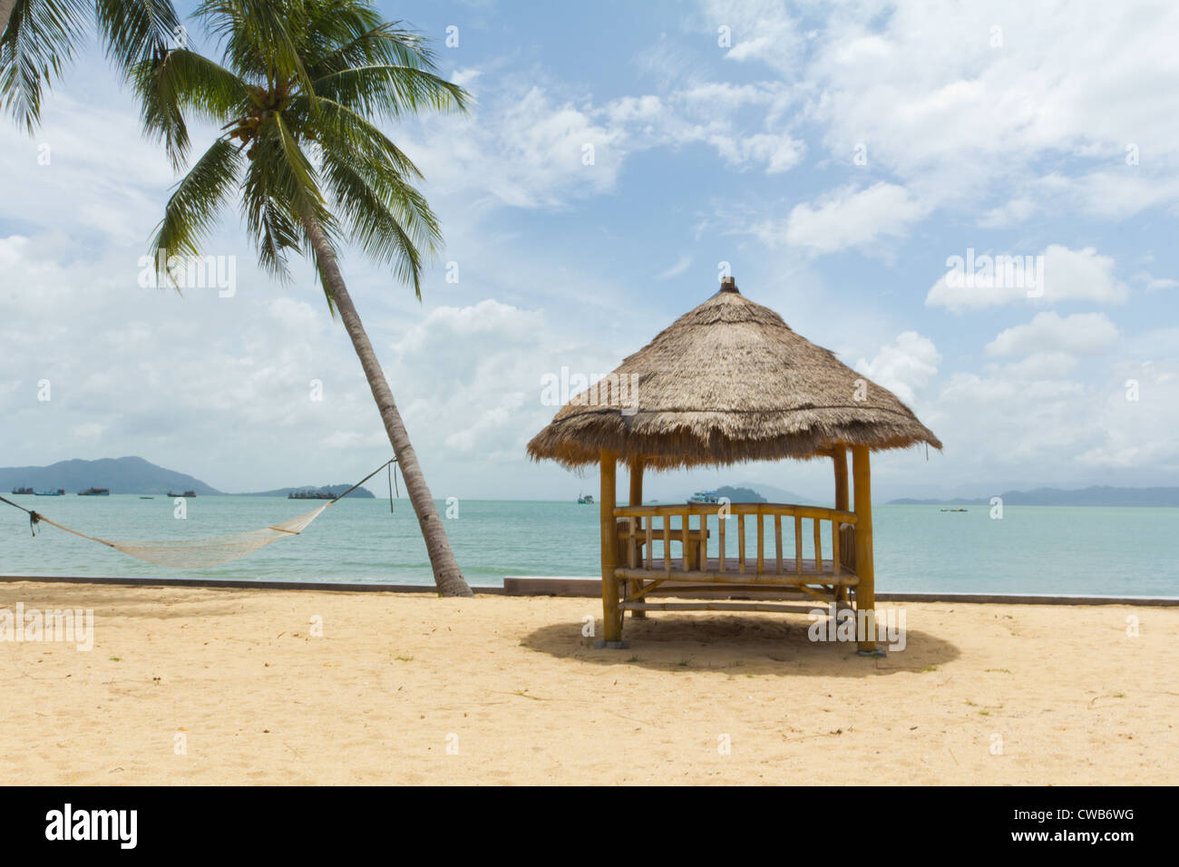 Tropical gazebo with chairs on amazing beach palm tree Stock Photo - Alamy
