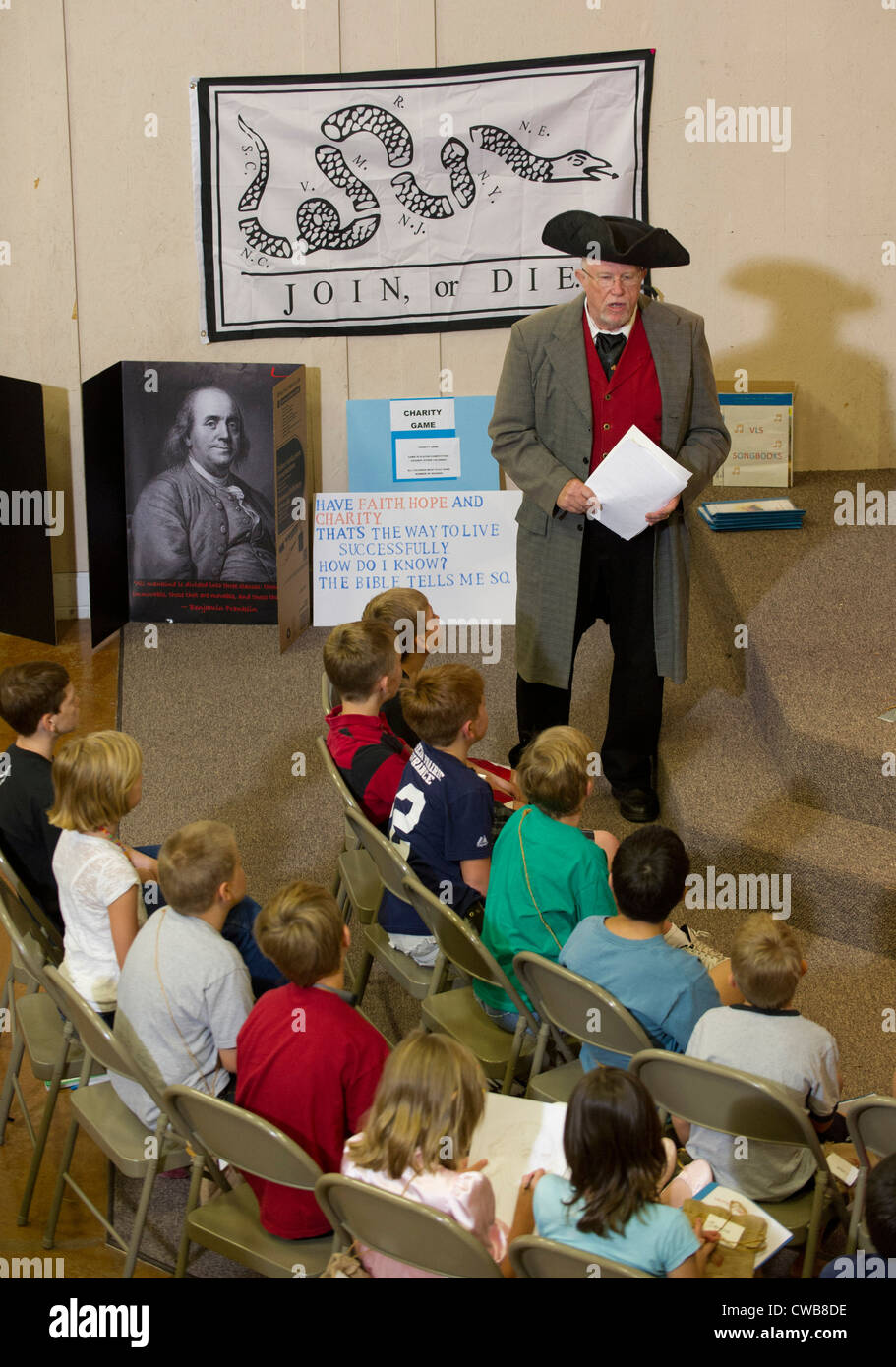 A teacher dressed as American founding father Ben Franklin speaks to ...