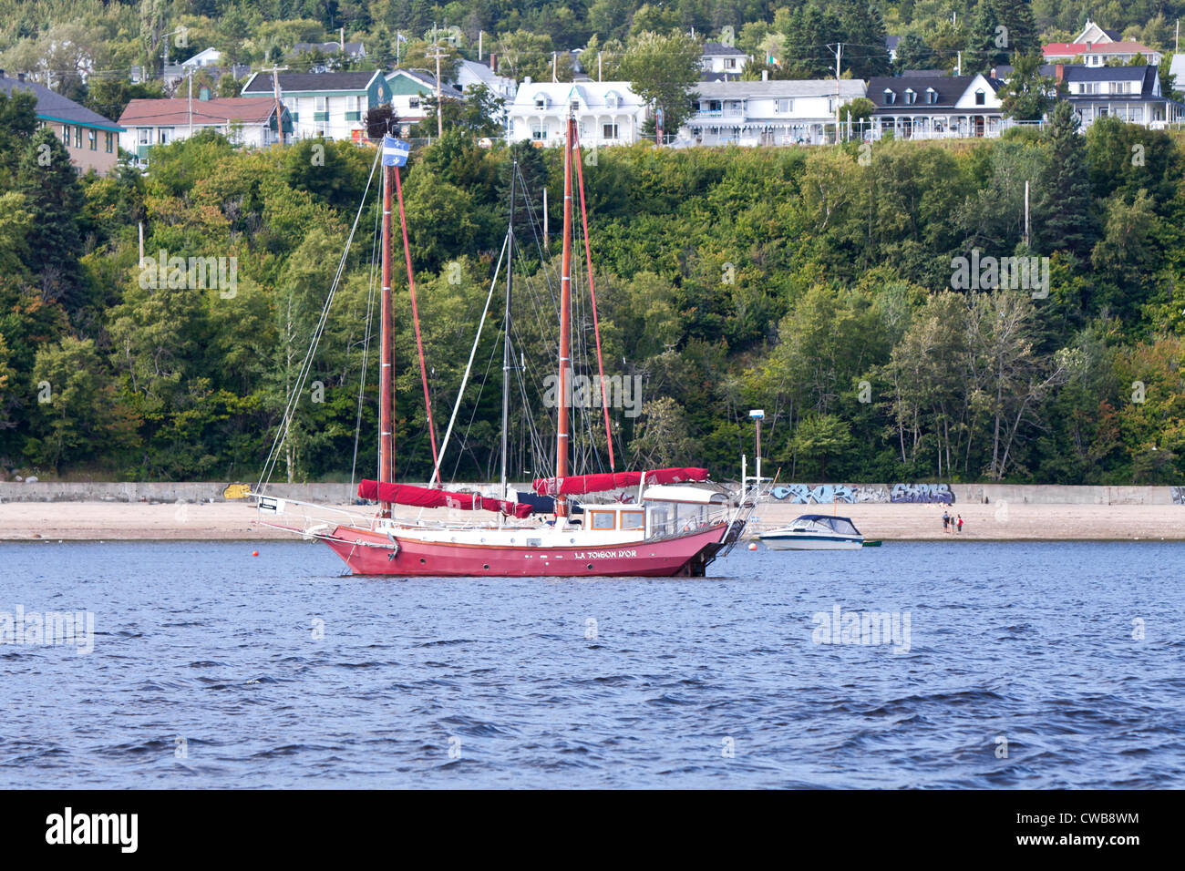 Two-masted sail boat anchored in Tadoussac marina Stock Photo - Alamy